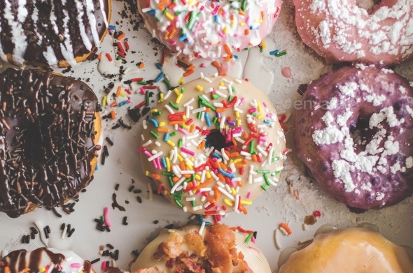 Celebrating National Donut Day with a box of sweet colorful donuts with ...