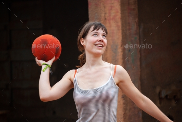 White girl throwing a red ball during an outdoor game Stock Photo by ...