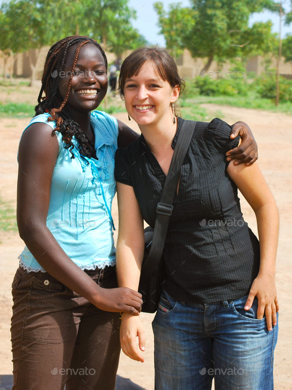 Portrait of two friends, one white and one black. Diversity girl ...