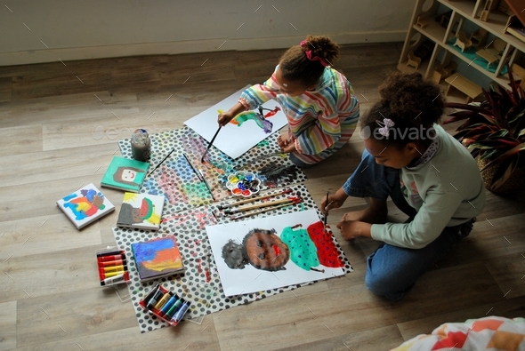 Siblings (mixed race) drawing and painting (paintbrush) and colorful ...