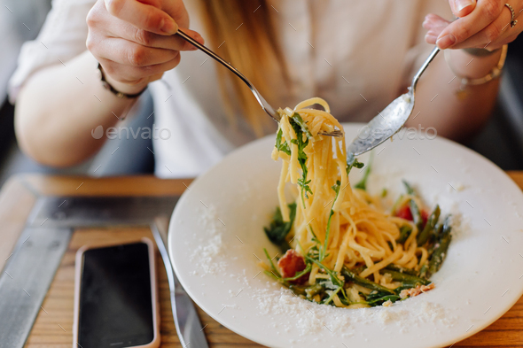 Friends enjoying lunch in the restaurant, eating paste Stock Photo by ...
