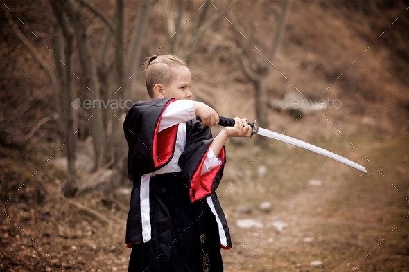 Way of the Samurai Boy dressed as a samurai stands with katana Stock ...