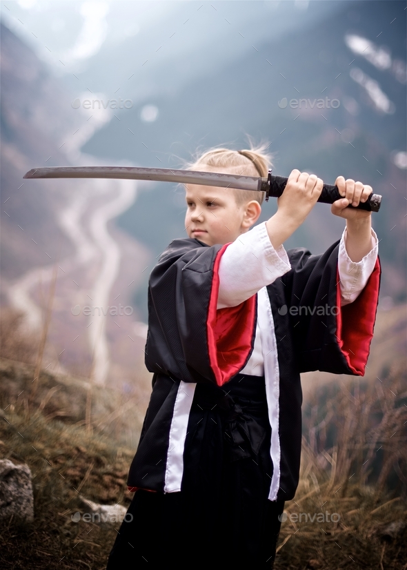 Way of the Samurai Boy dressed as a samurai stands with katana Stock ...