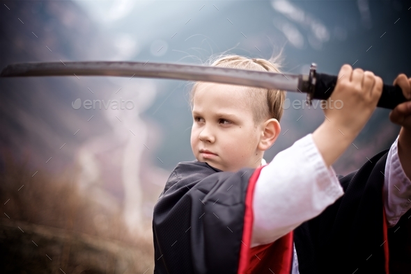 Way of the Samurai Boy dressed as a samurai stands with katana Stock ...