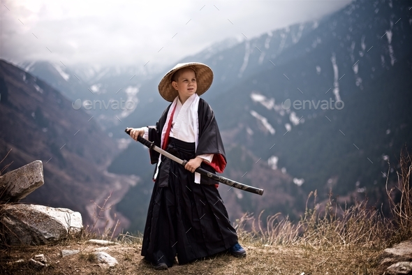 Way of the Samurai Boy dressed as a samurai stands with katana Stock ...