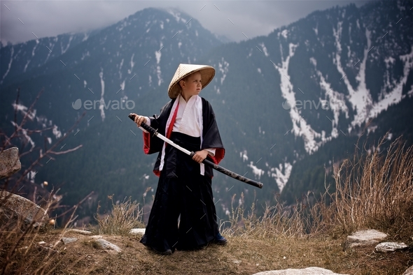 Way of the Samurai Boy dressed as a samurai stands with katana Stock ...