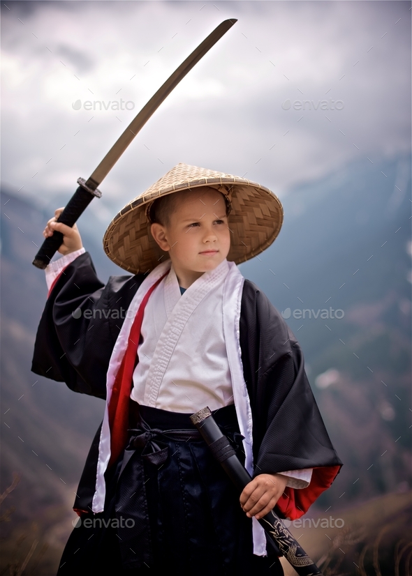 Way of the Samurai Boy dressed as a samurai stands with katana Stock ...