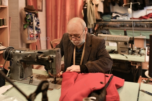 Old man sews in his atelier Stock Photo by o1559kip | PhotoDune