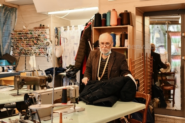 Old man sews in his atelier Stock Photo by o1559kip | PhotoDune