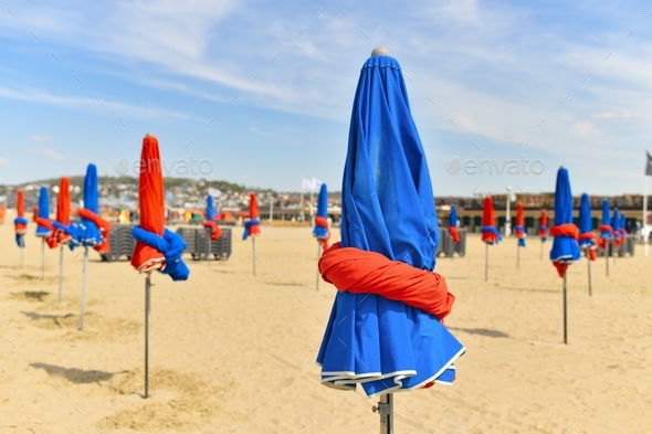 Stacked sun umbrellas on the beach Stock Photo by o1559kip | PhotoDune