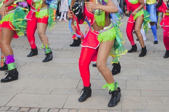 The caribbean women dancing in costumes in downtown Stock Photo by o1559kip