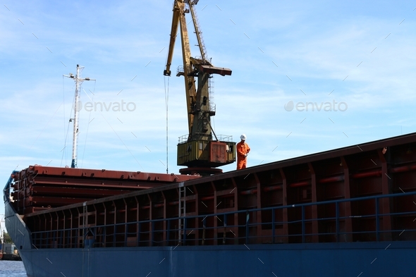 Worker on a barge Stock Photo by Banyushka | PhotoDune