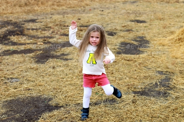 Little girl crying in hysterics, waving her arms actively Stock Photo ...