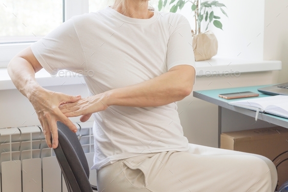 exercise at a computer table to warm up muscles during sedentary work ...