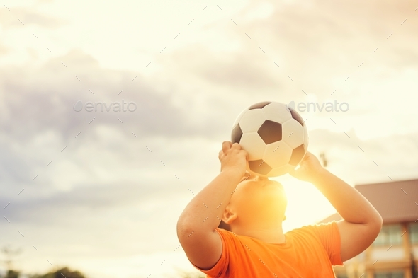 action sport outdoors of kids having fun playing soccer football for ...