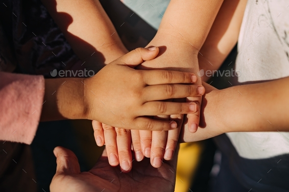 kids hands together with family and friends team Stock Photo by natee127
