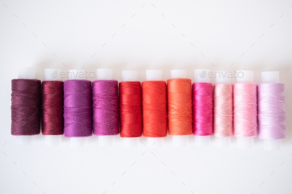 Sewing machine threads in red colors. Flat lay, top view Stock Photo by ...
