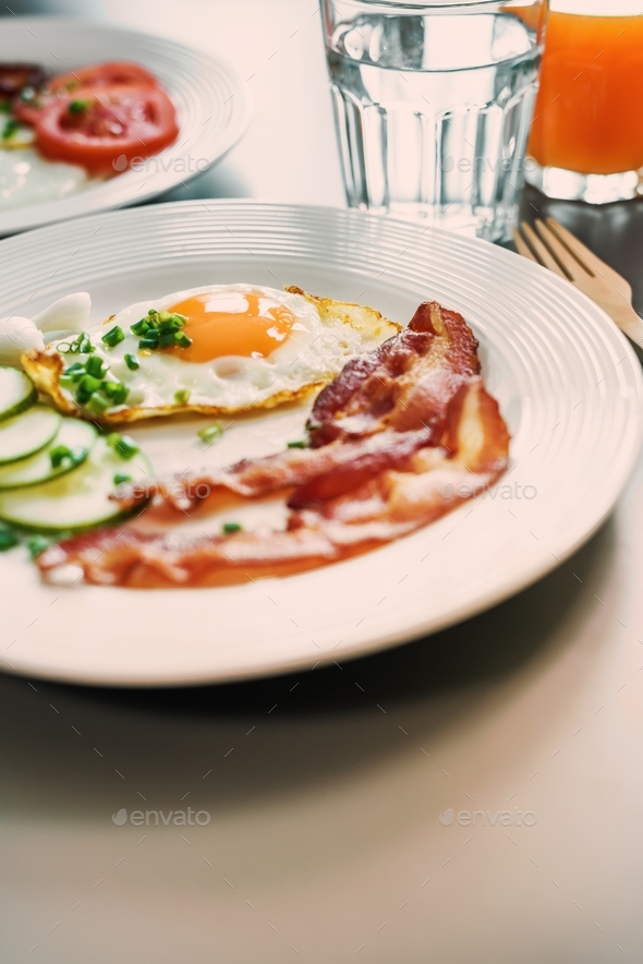Breakfast set menu with sunny side up eggs with crispy bacon ...