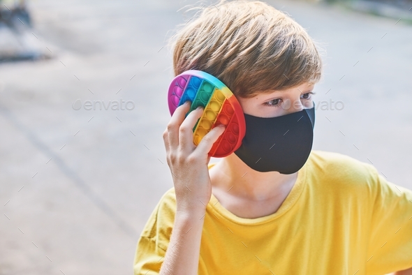 Imitating using mobile phone Boy in black mask Push Popper fidget toy ...