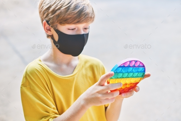 Boy in black mask Push Popper fidget toy is the ideal toy to get rid of ...