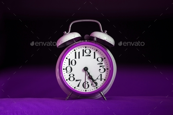 Purple retro alarm clock. Stock Photo by davidcharouz | PhotoDune