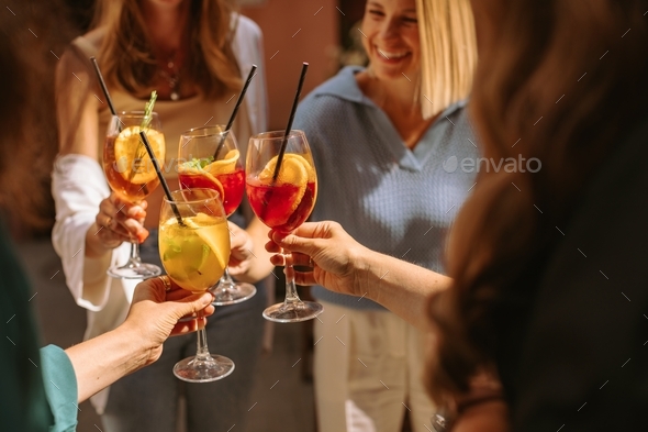 Happy friends cheers their drinks together, celebrating birthday. Stock ...