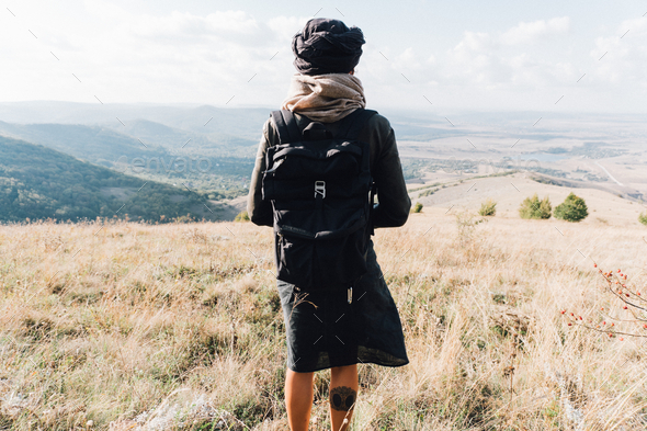 Woman from behind looking at the epic view Stock Photo by kirillvasilevcom