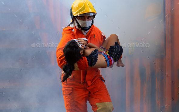 Fire fighting team rescue life saving young girl from fire burn and ...
