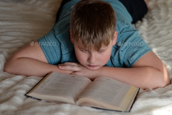 boy reading a book Stock Photo by nata_llo | PhotoDune