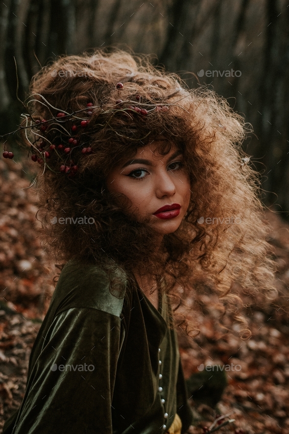 Portrait of a curly haired princess girl in the forest Stock Photo by ...