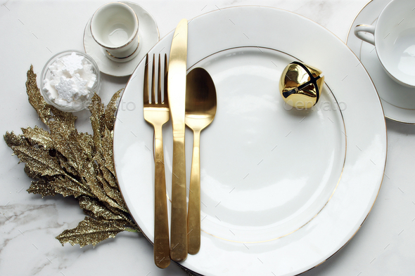 Elegant place setting with gold winter theme Stock Photo by MPPLLC45