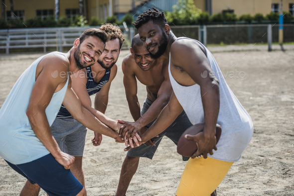 group of young multicultural male football players on court Stock Photo ...