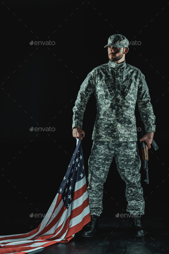 soldier with united states flag and rifle isolated in black Stock Photo ...