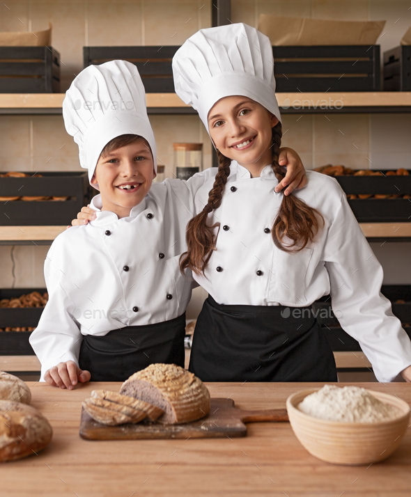 Happy bakers hugging during work Stock Photo by kegfire | PhotoDune