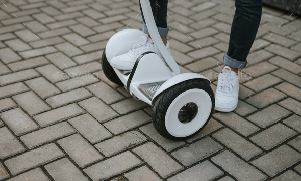 Crop male stepping on white gyroscooter Stock Photo by kegfire | PhotoDune