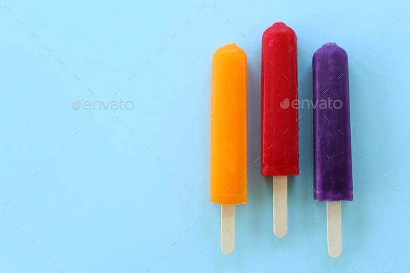 Rainbow popsicles with blue background Stock Photo by MPPLLC45 | PhotoDune