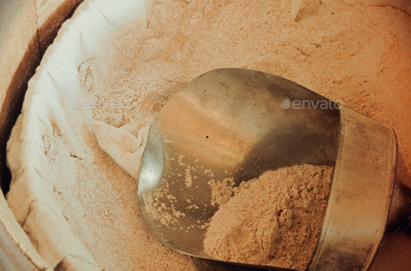 Vintage flour barrel with scoop. Stock Photo by MPPLLC45 | PhotoDune