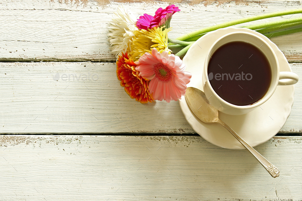 White wood table with gerber daisy and coffee Stock Photo by MPPLLC45