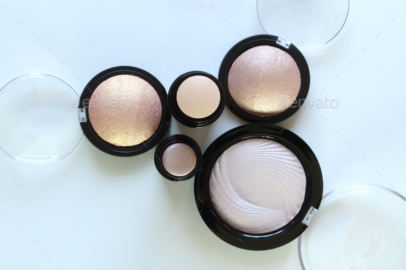 Makeup compacts in varying colors of blush, highlighter and foundation ...