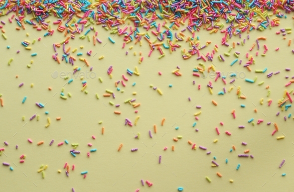 Yellow background with colored sprinkles Stock Photo by MPPLLC45 ...