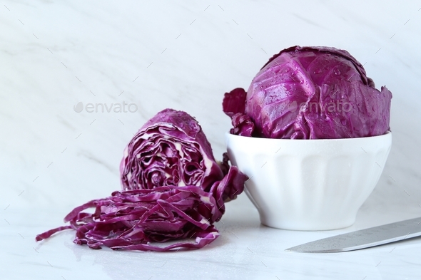 Purple cabbage whole and sliced with copy space Stock Photo by MPPLLC45