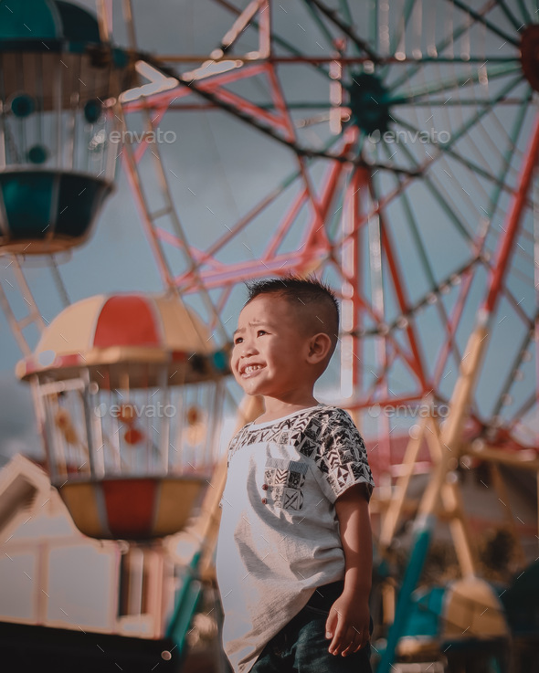 Happy kids at amusement park Stock Photo by King_satriaru | PhotoDune