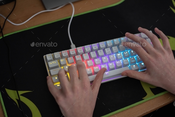 A close up shoot of a young boy using colorful keyboard Stock Photo by ...