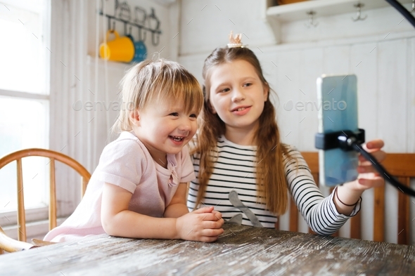 Smiling cute Influencer children bloggers recording video blog, kids ...