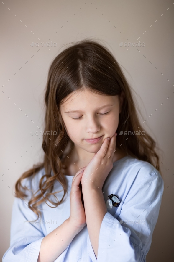 Charming European tender teen girl with long hair, close-up portrait ...
