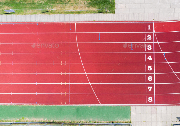 Aerial view of the finish line on an athletics track with numbered ...