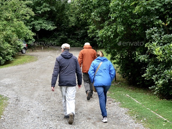 Three people walking Stock Photo by Danibaal | PhotoDune