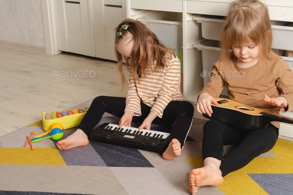 Happy children playing musical instruments at home Stock Photo by ...