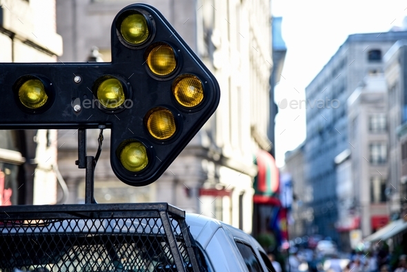 Illuminated Directional arrow on construction vehicle Stock Photo by ...