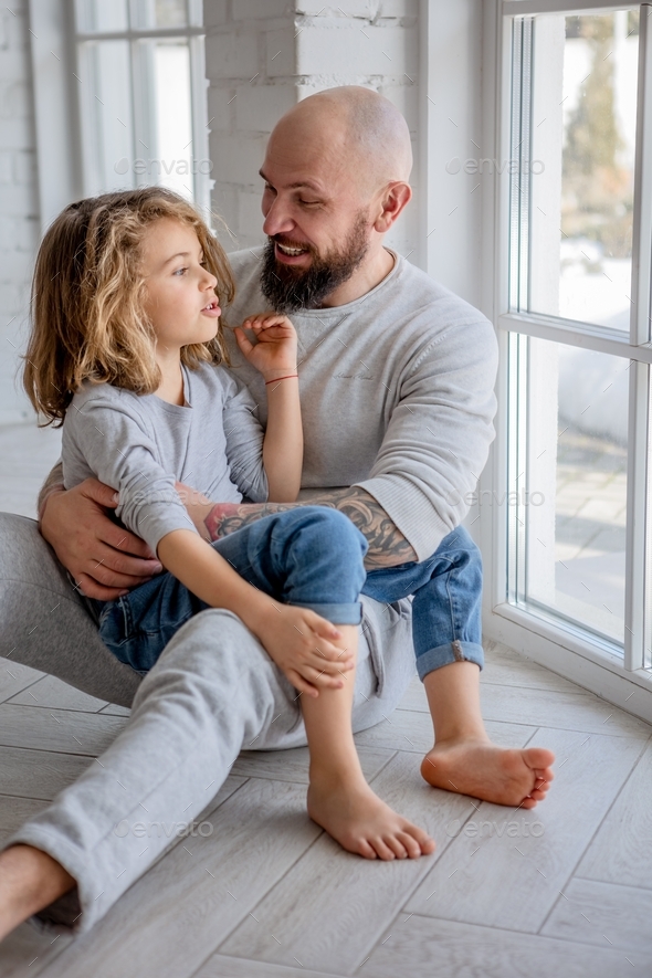 brutal bald dad with a beard imcute curly-haired boy 5-7 years old ...